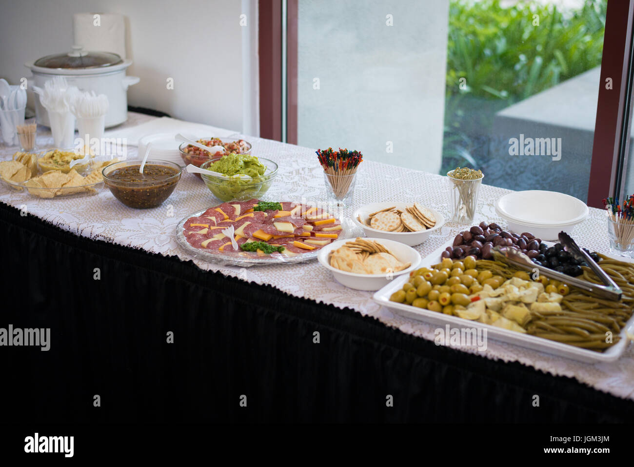Assortment of self serve snacks on a table Stock Photo - Alamy