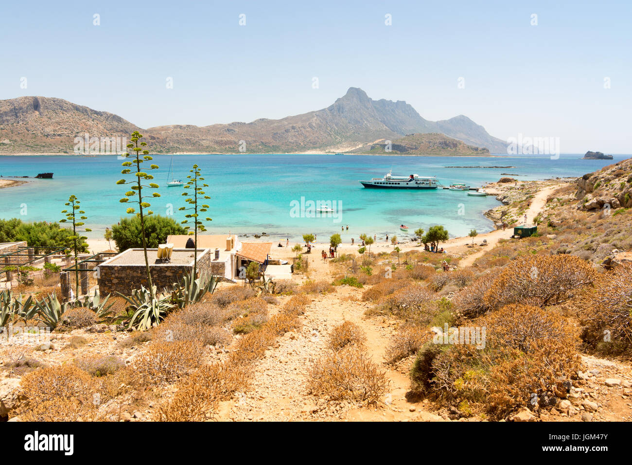 A tour boat anchored at the island of Gramvoussa, north-west, Crete ...