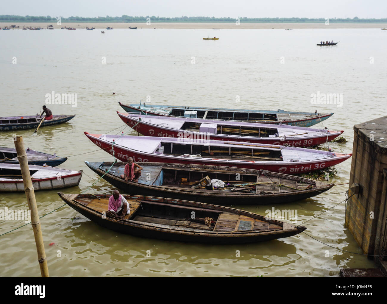 Varanasi, India - Jul 12, 2015. Many tourist boats waiting passengers ...