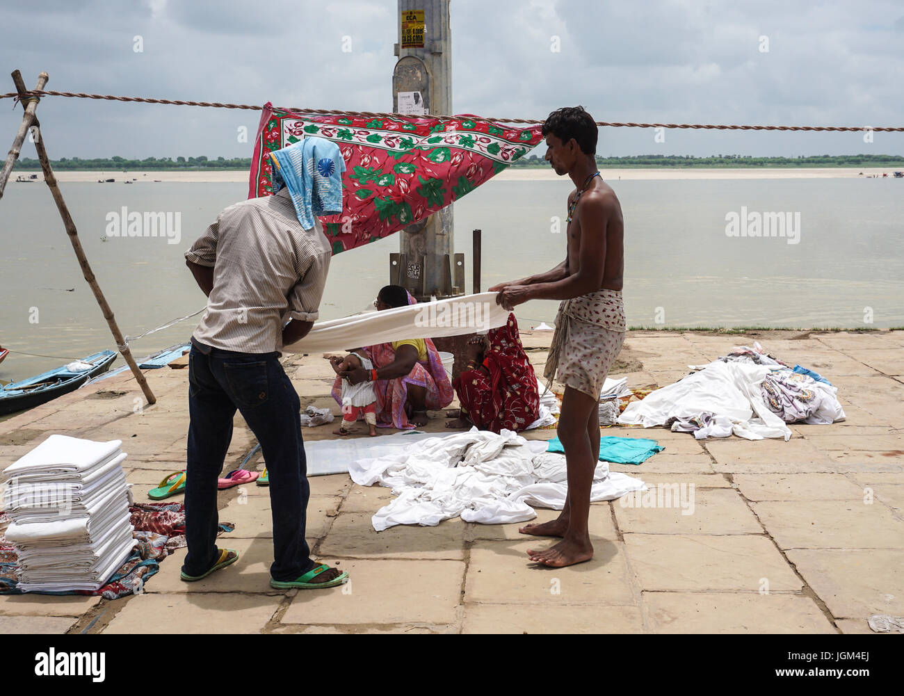 Indian man bathing washing clothes hi-res stock photography and images ...