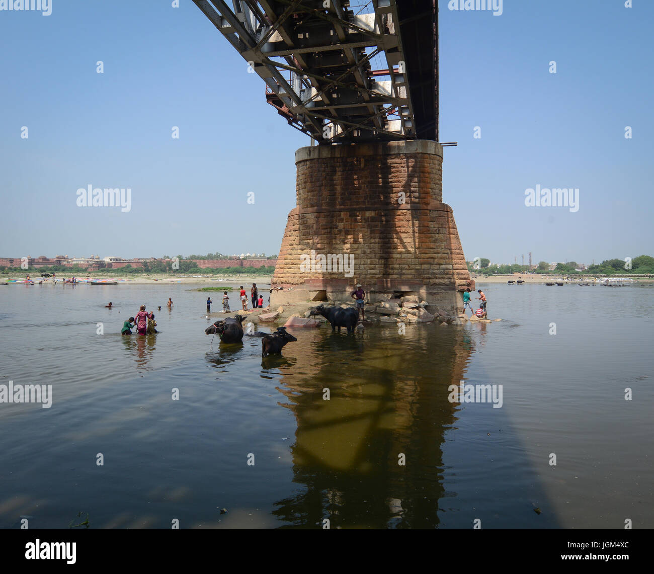 Agra, India - Jul 13, 2015. Steel bridge with Yamuna River at sunny day ...
