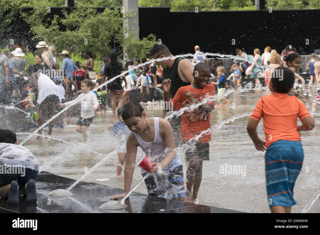 Kids and families cool off on a hot summer day at the water park ...