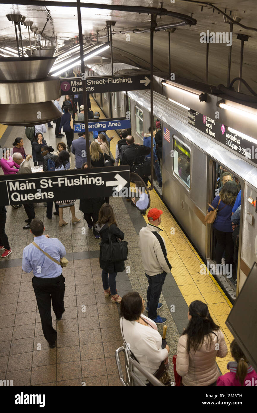 Riders wait for the 7 train at 42nd Street under Grand Central Terminal ...