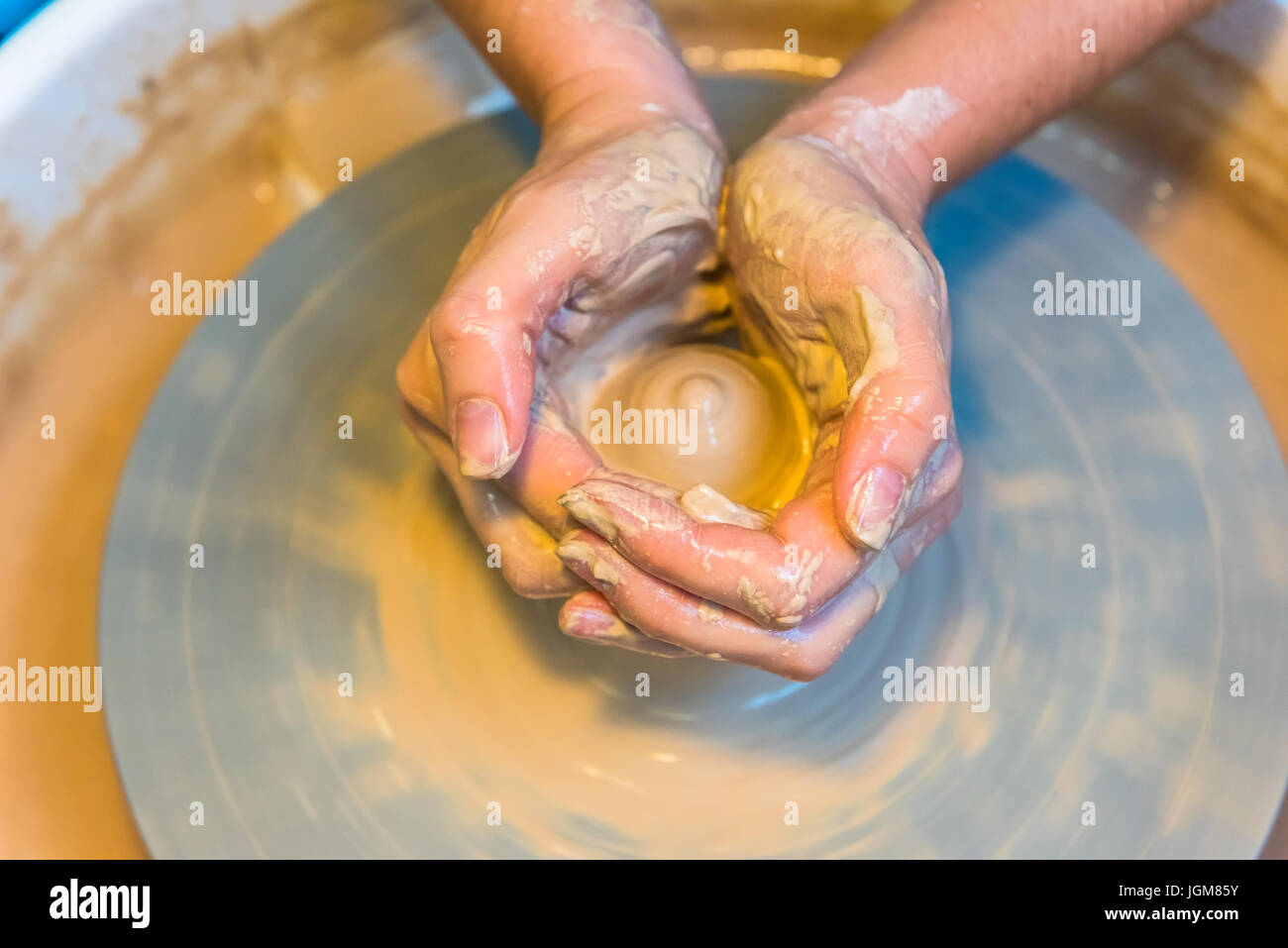 Pottering - creating a clay cup in process. Shot with a small GRIP ...