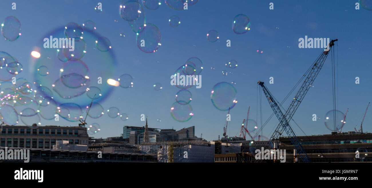 Blowing bubbles on London riverbank Stock Photo - Alamy