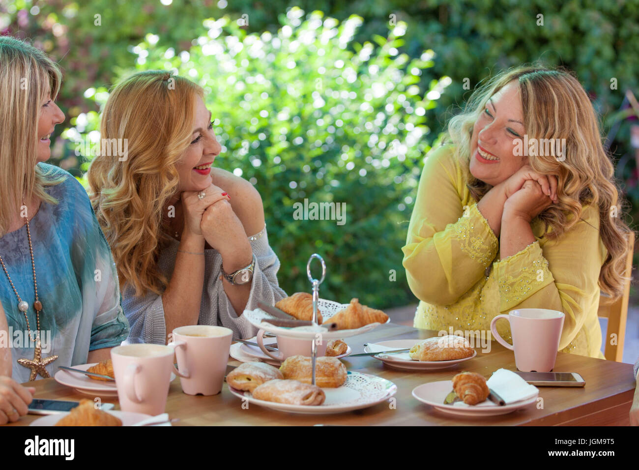happy group women friends meeting for coffee and cakes Stock Photo - Alamy