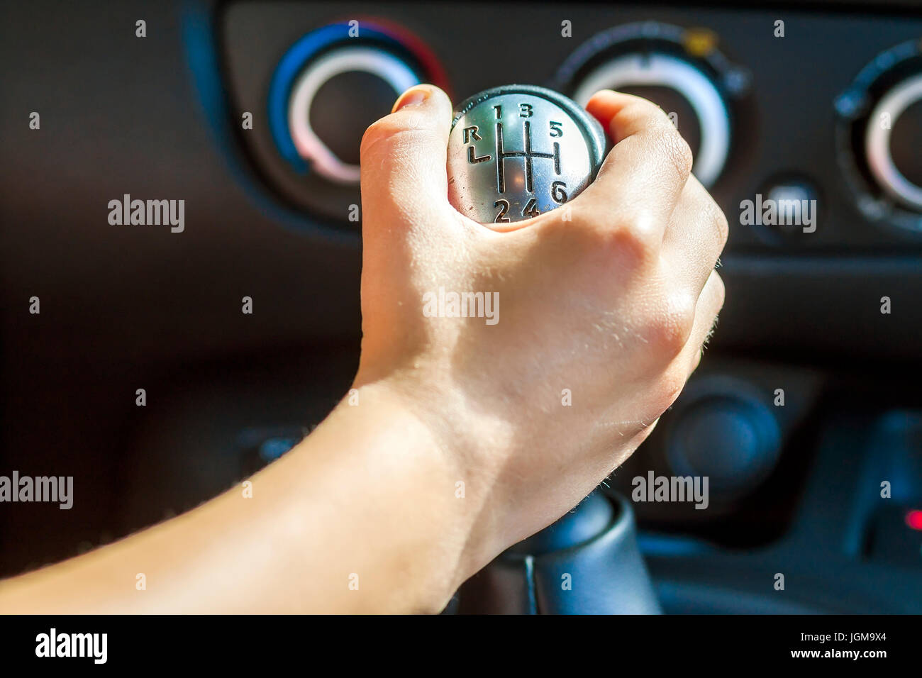 Driver hand shifting gear shift knob manually, selective focus Stock ...