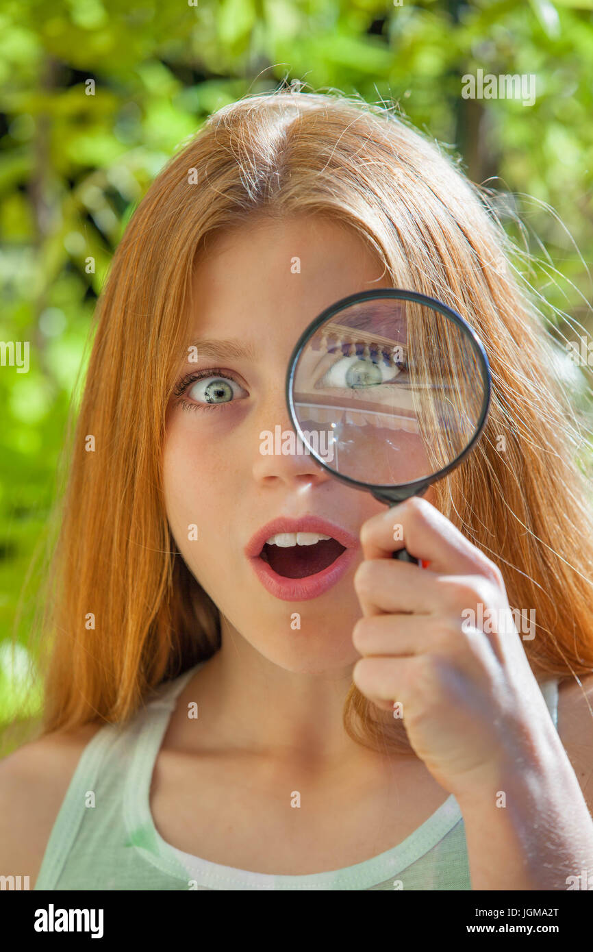 child with magnifying glass Stock Photo - Alamy