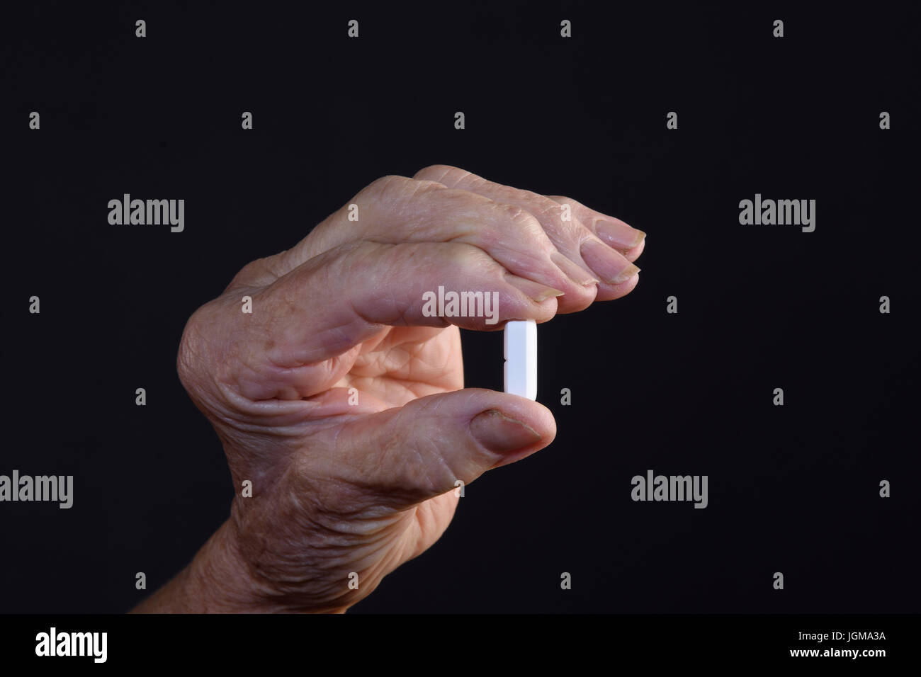 Hand of an old woman with a pill and fungus on the nails Stock Photo ...