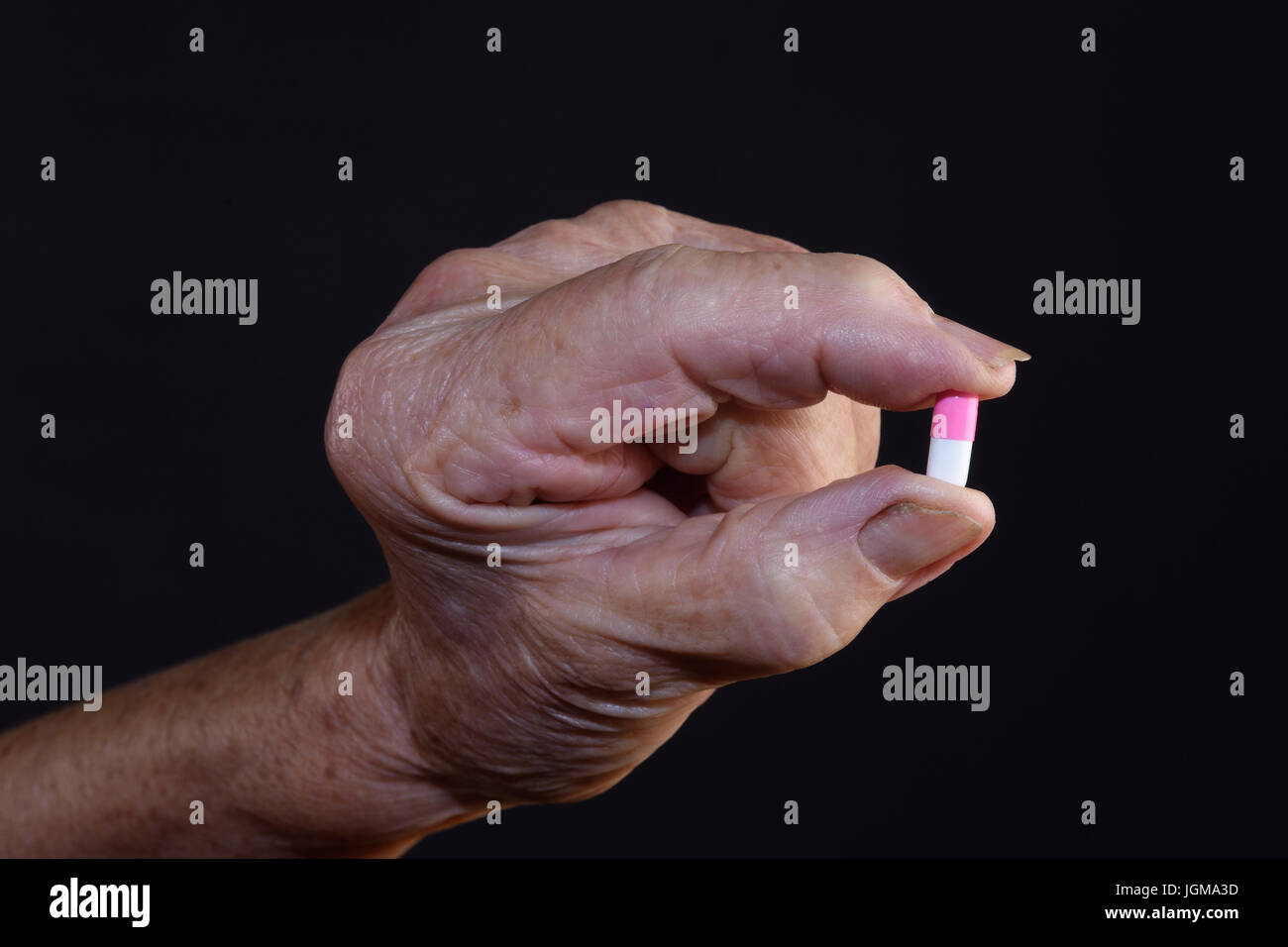 Hand of an old woman with a pill and fungus on the nails Stock Photo ...