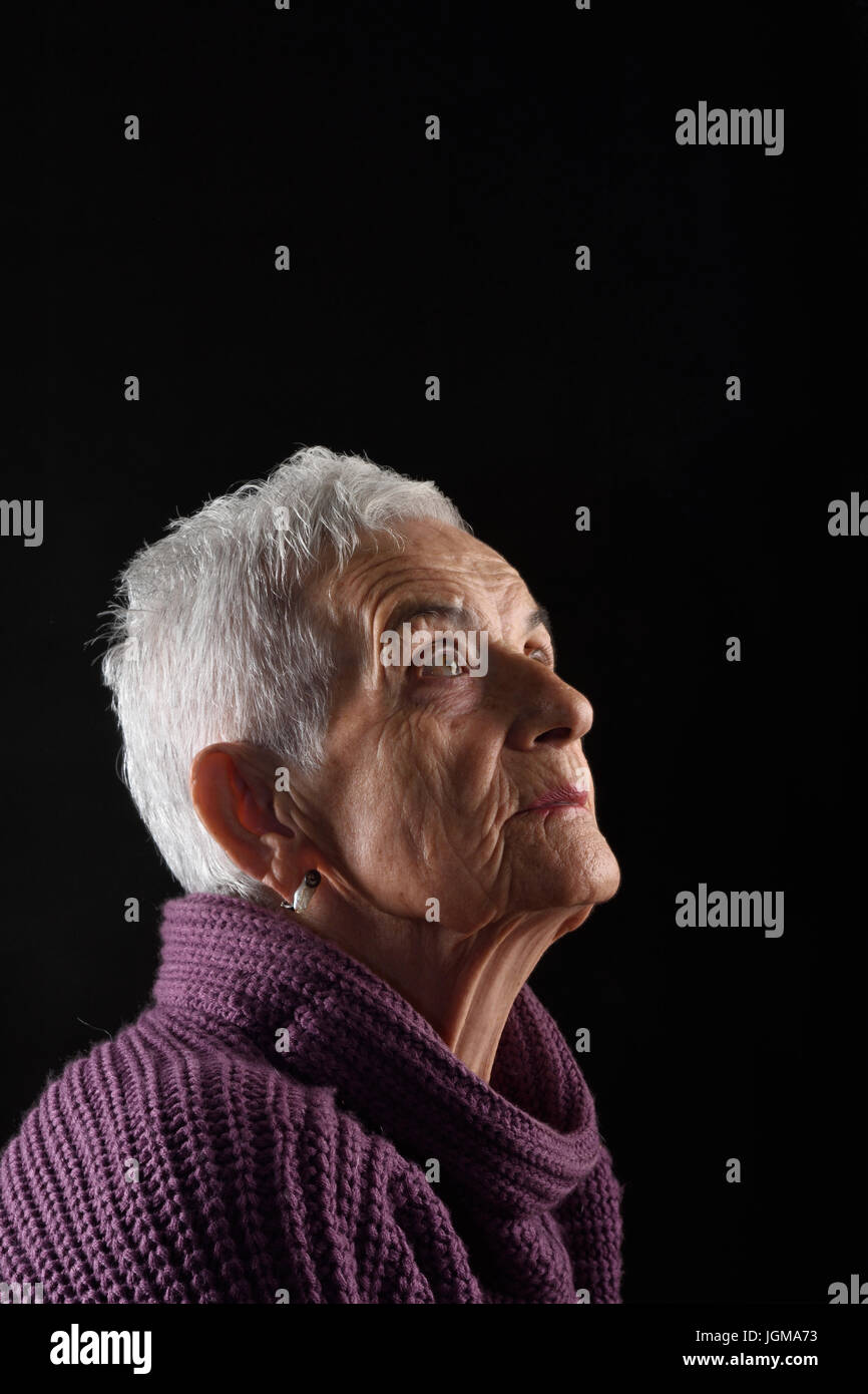 Senior woman looking up Stock Photo - Alamy