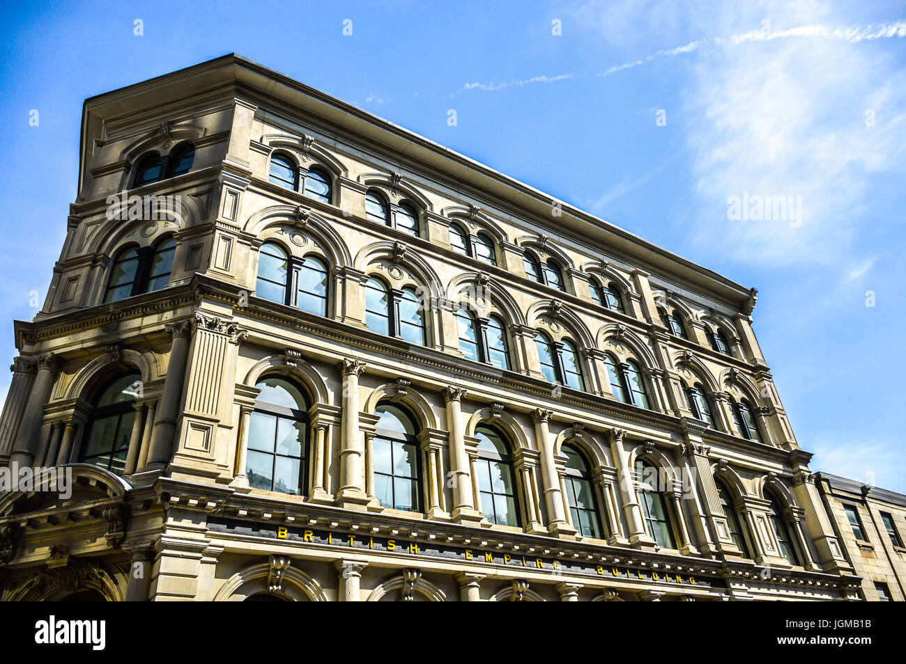 An old historical building with the large windows in the old port of ...