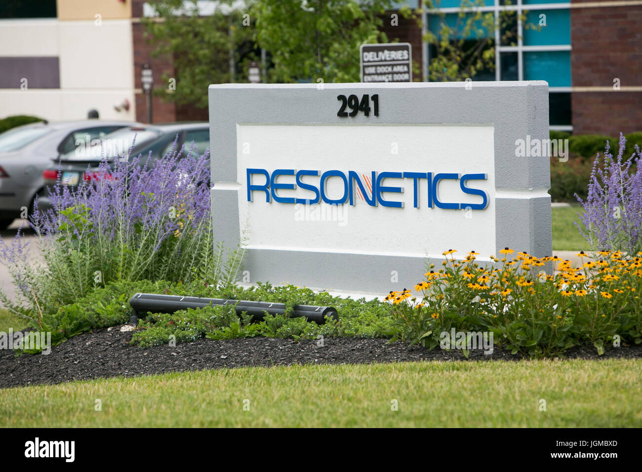 A logo sign outside of a facility occupied by Resonetics in Kettering ...