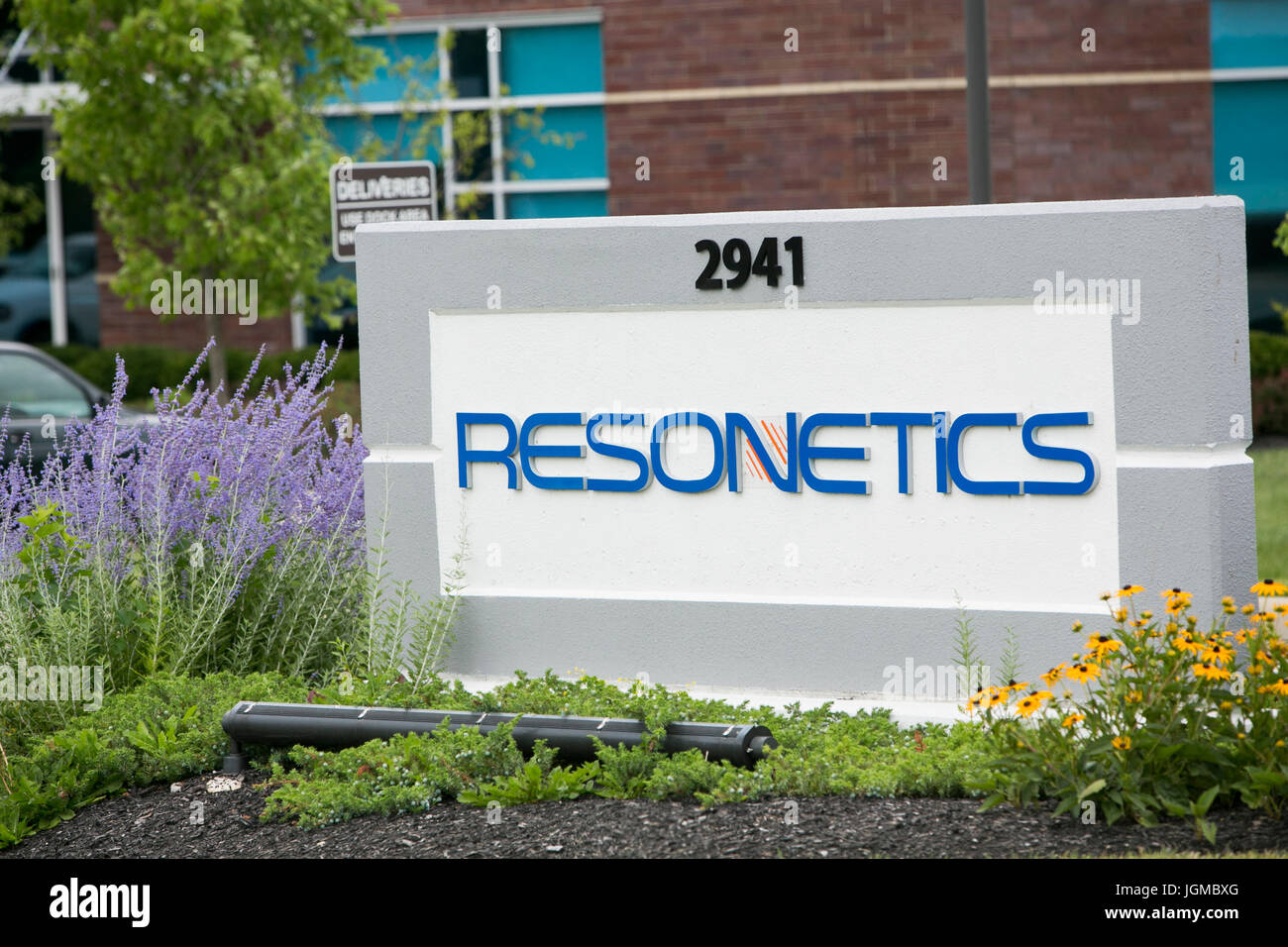 A logo sign outside of a facility occupied by Resonetics in Kettering ...