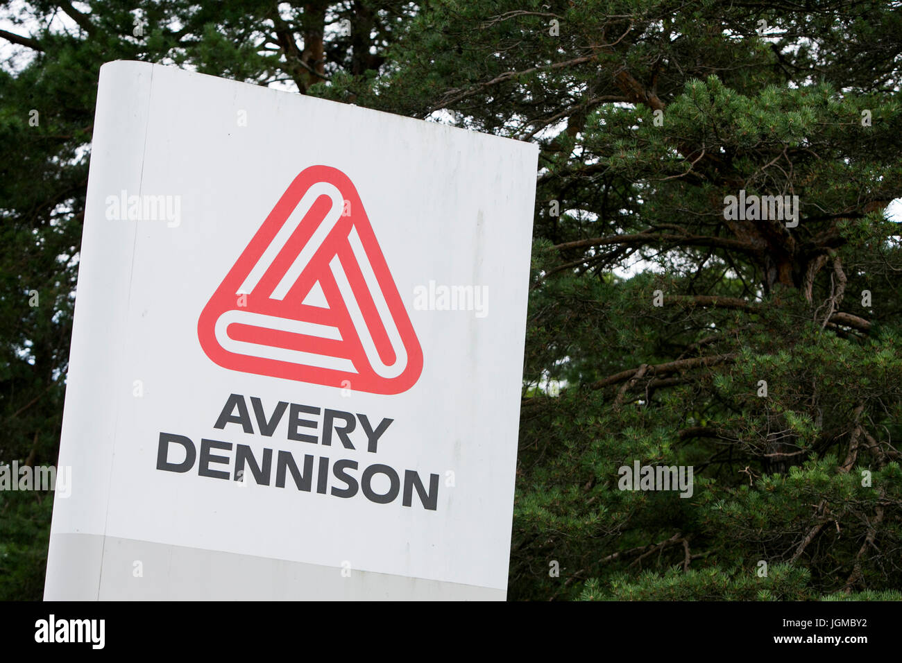 A logo sign outside of a facility occupied by the Avery Dennison ...