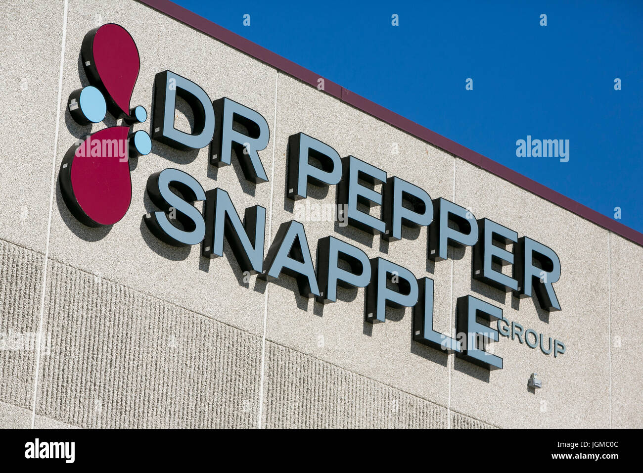 A logo sign outside of a facility occupied by the Dr Pepper Snapple ...