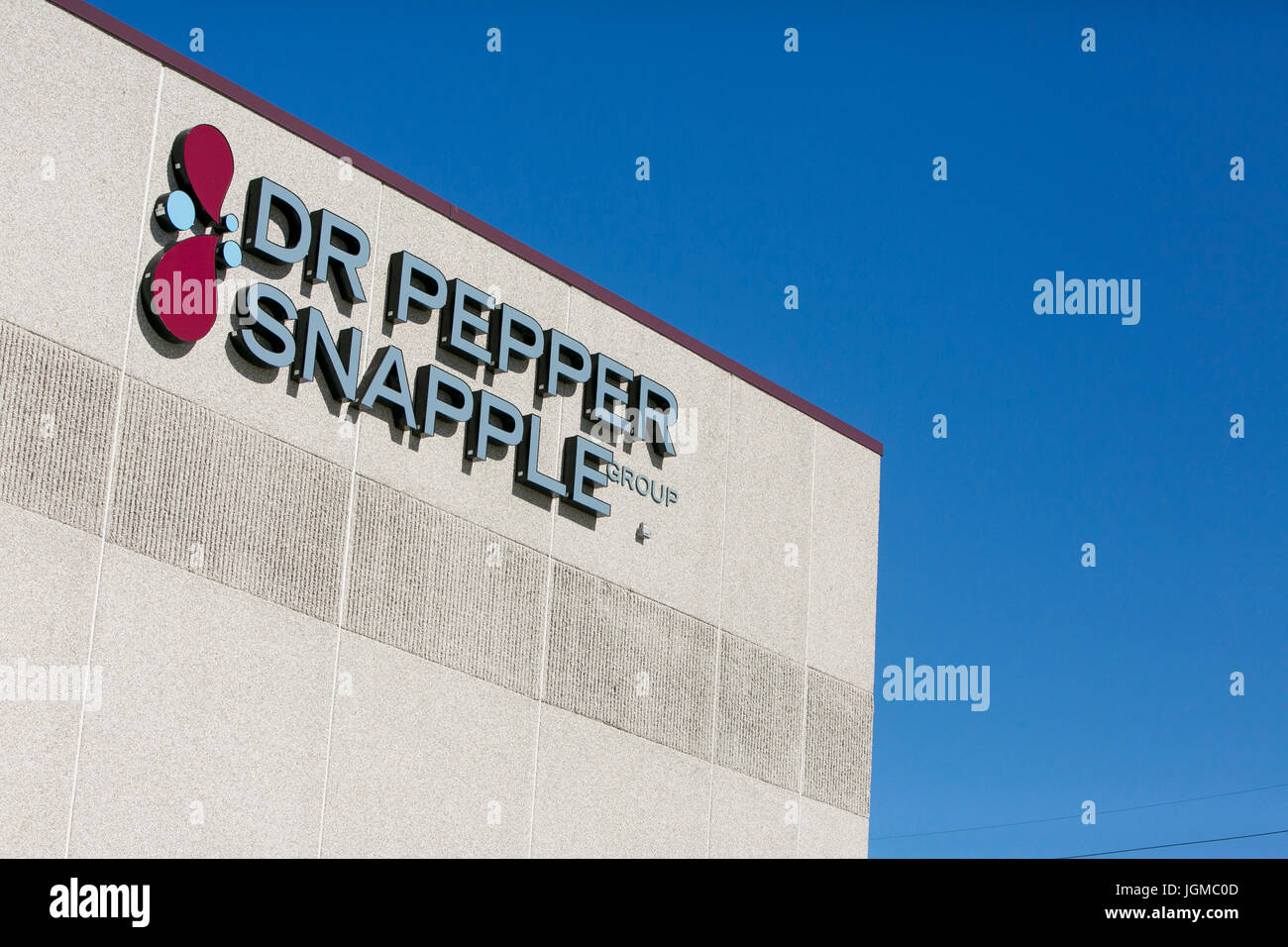 A logo sign outside of a facility occupied by the Dr Pepper Snapple ...