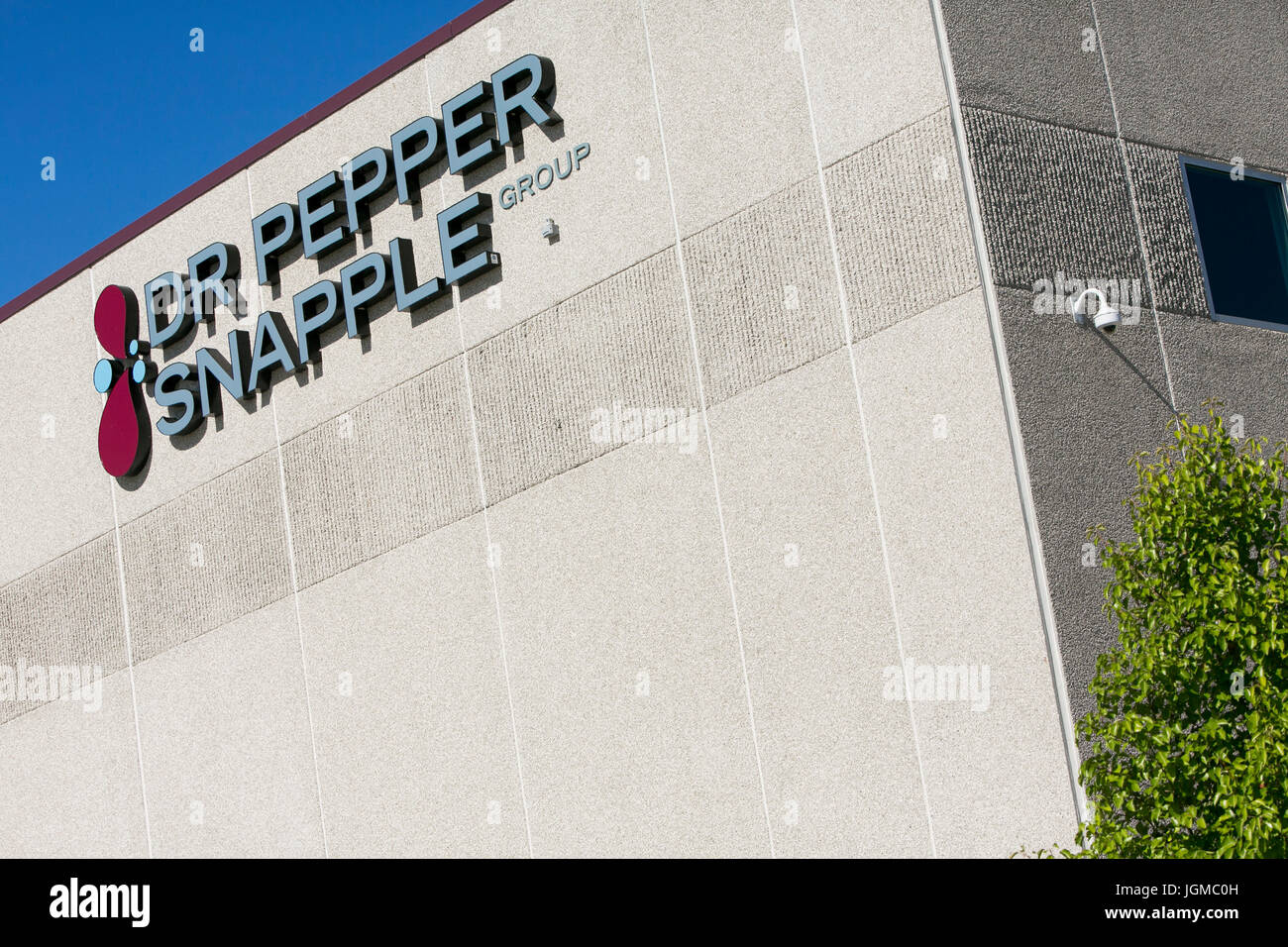 A logo sign outside of a facility occupied by the Dr Pepper Snapple ...