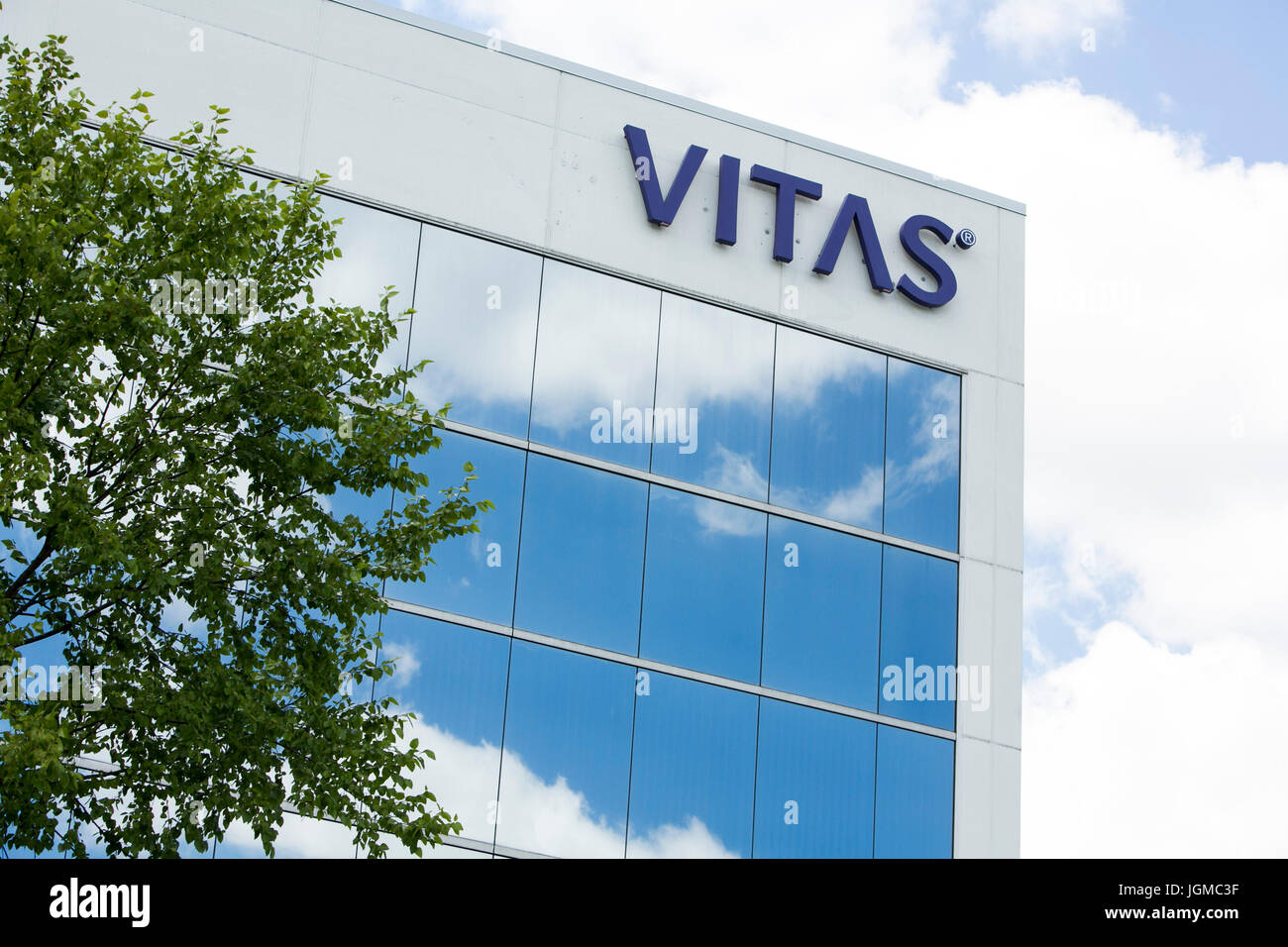 A logo sign outside of a facility occupied by VITAS Healthcare in ...