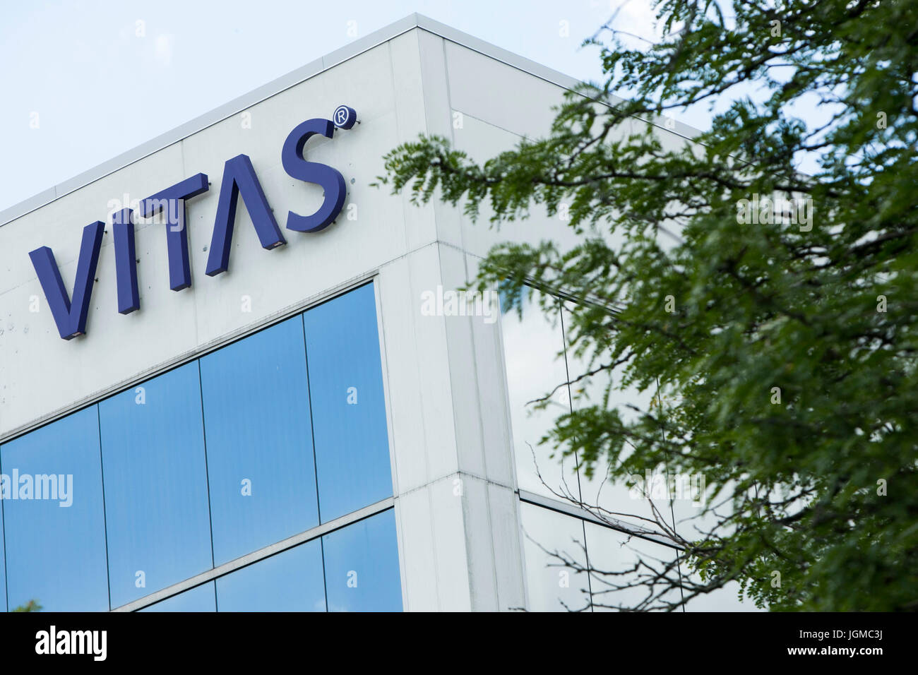 A logo sign outside of a facility occupied by VITAS Healthcare in ...