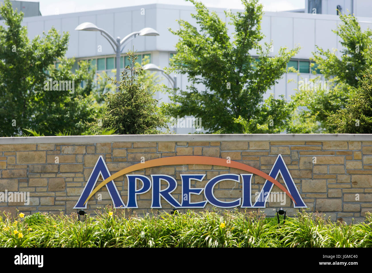 A logo sign outside of a facility occupied by Aprecia Pharmaceuticals ...