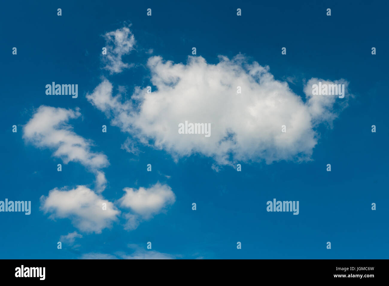 Clear blue sky with clouds with blank space Stock Photo - Alamy