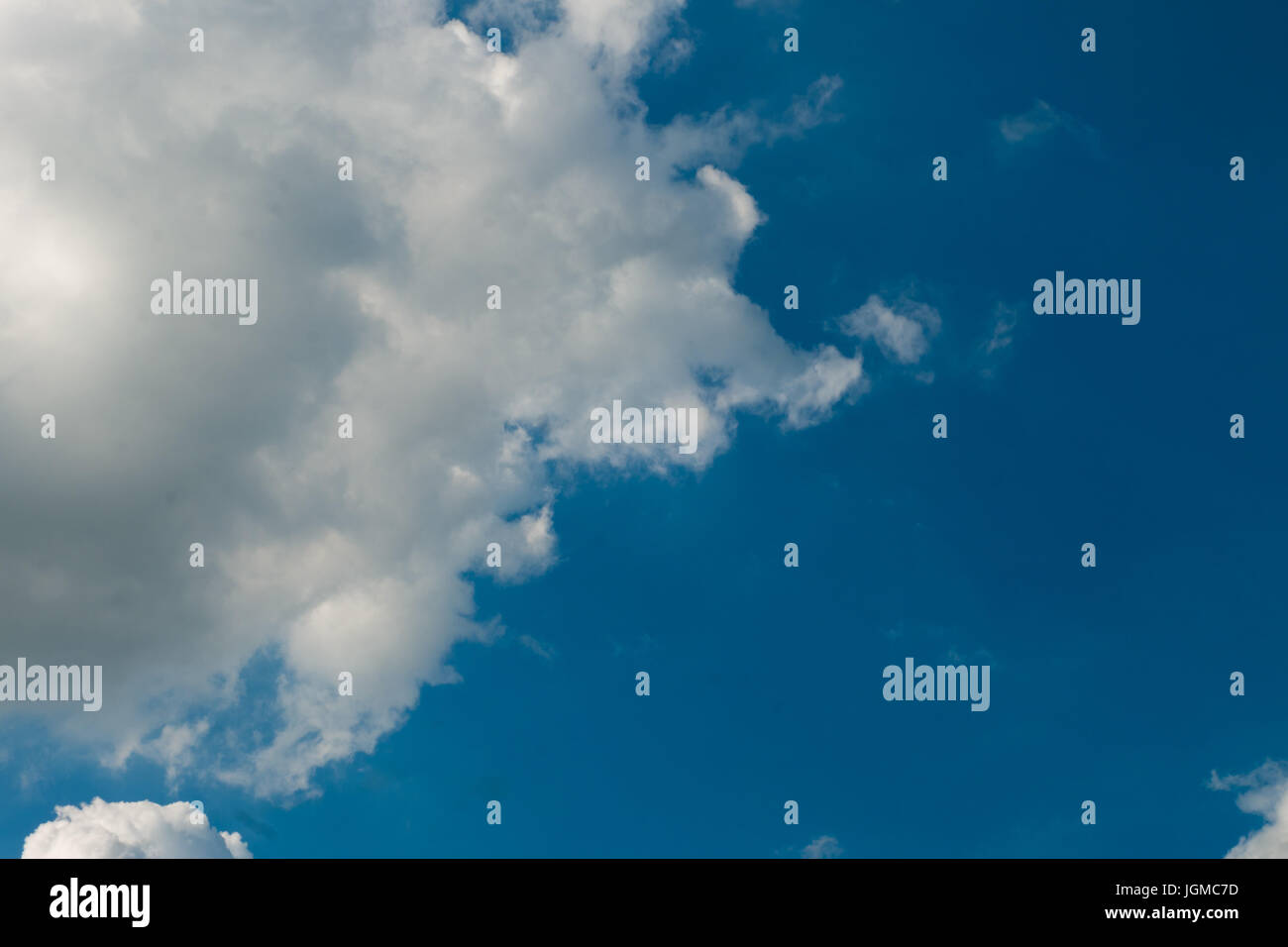 Clear blue sky with clouds with blank space Stock Photo - Alamy