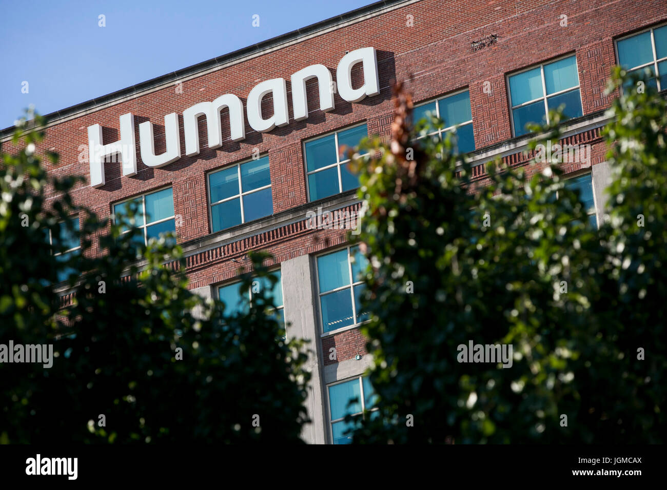 A logo sign outside of a facility occupied by Humana Inc., in ...