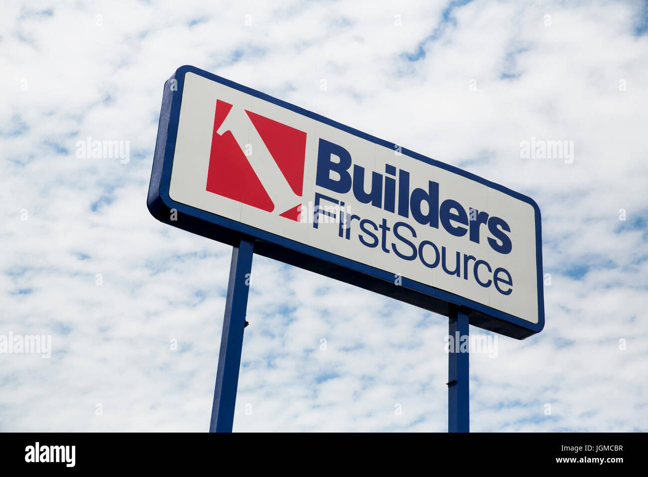 A logo sign outside of a facility occupied by Builders FirstSource, Inc ...