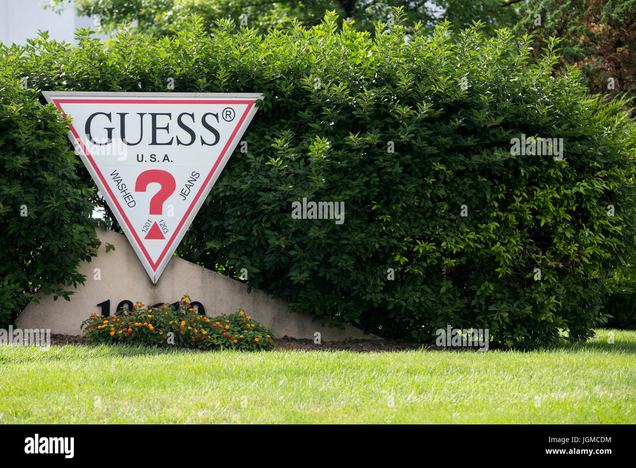 A logo sign outside of a facility occupied by Guess, Inc., in ...