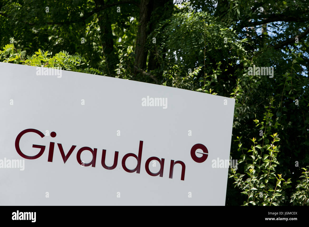 A logo sign outside of a facility occupied by Givaudan in Florence ...