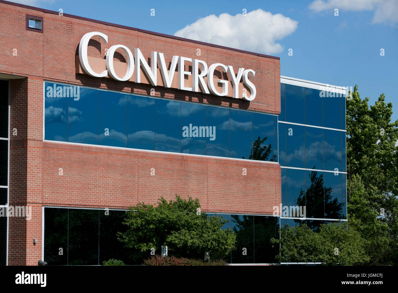 A logo sign outside of a facility occupied by the Convergys Corporation ...