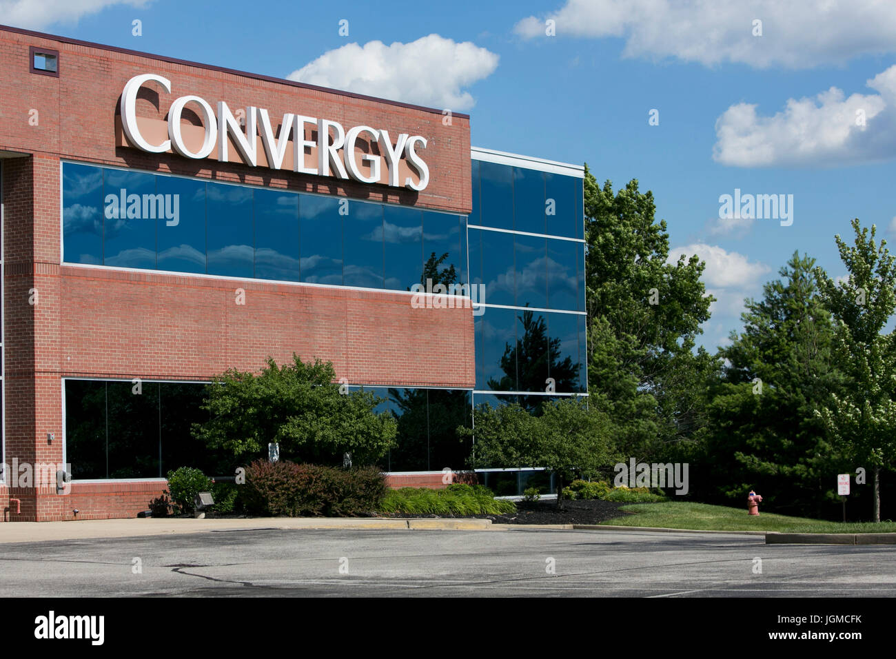 A logo sign outside of a facility occupied by the Convergys Corporation ...