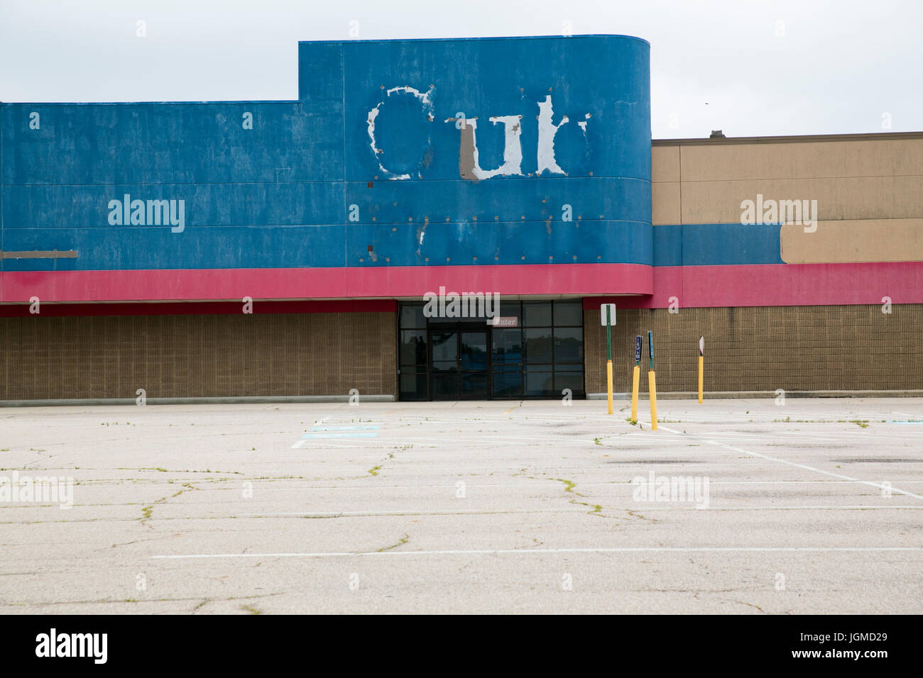 A logo sign outside of a closed and abandoned Cub Foods retail store in ...