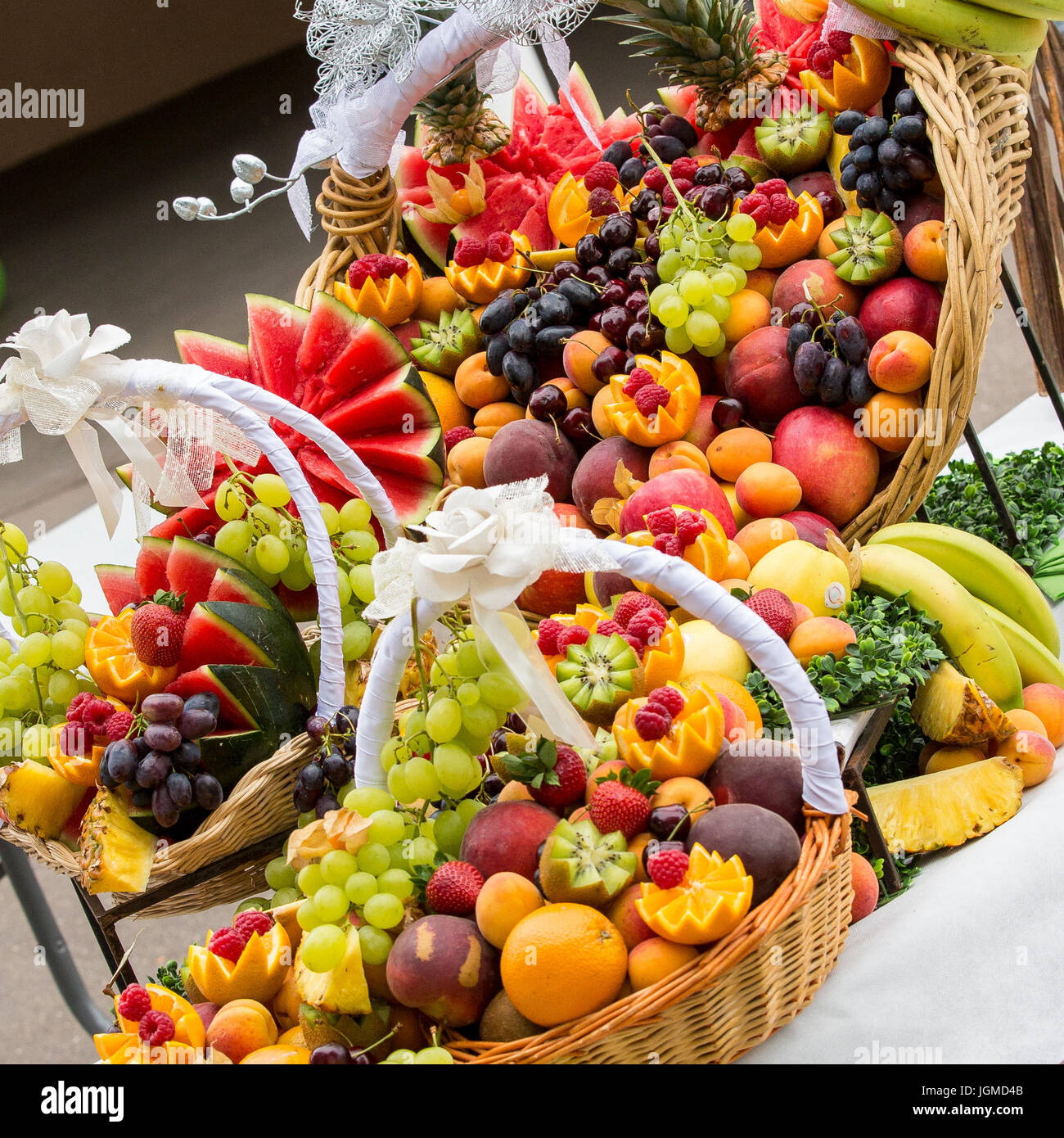 Composition of assortment of fresh fruits in baskets Stock Photo - Alamy
