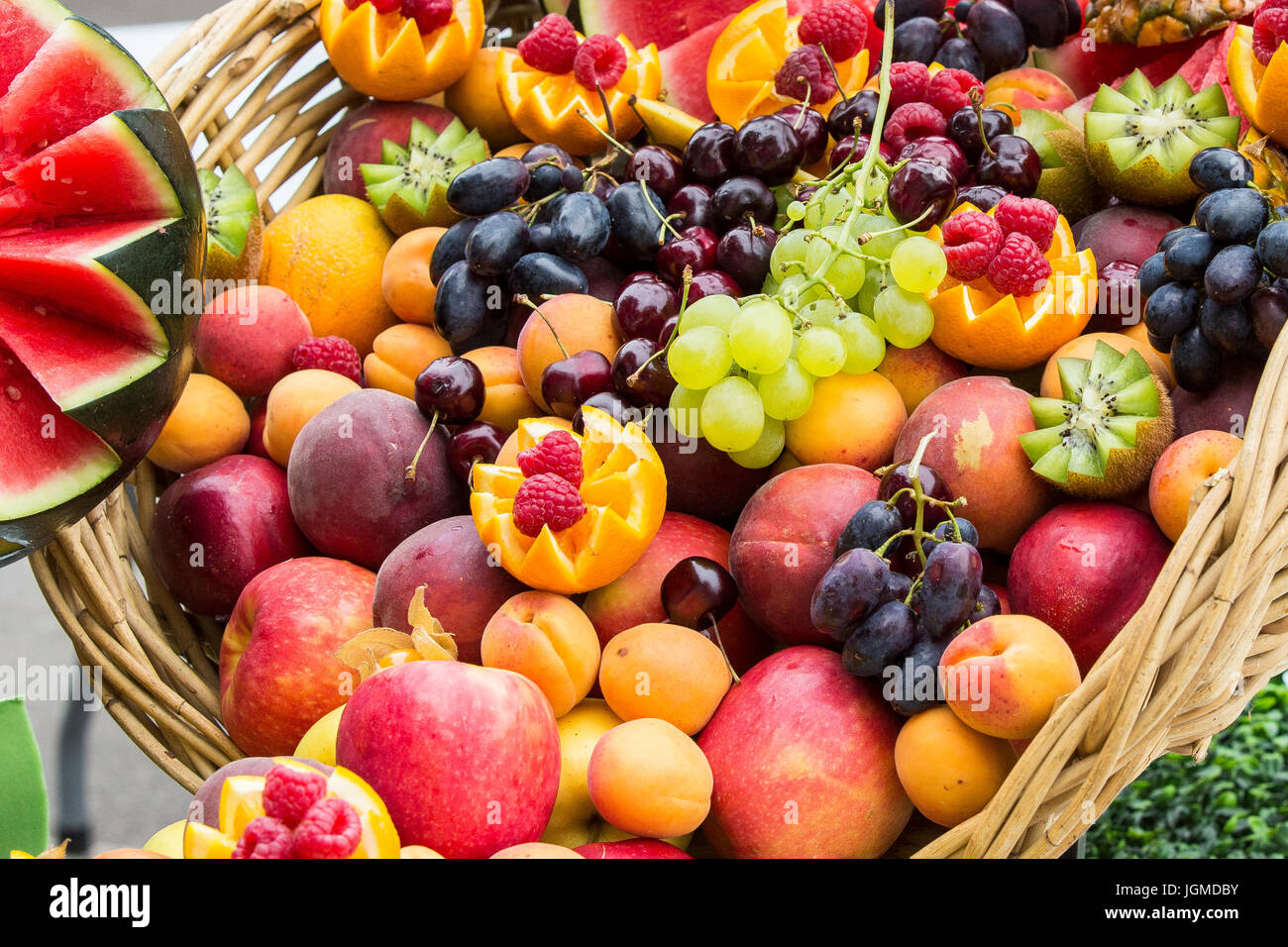 Composition of assortment of fresh fruits in baskets Stock Photo - Alamy