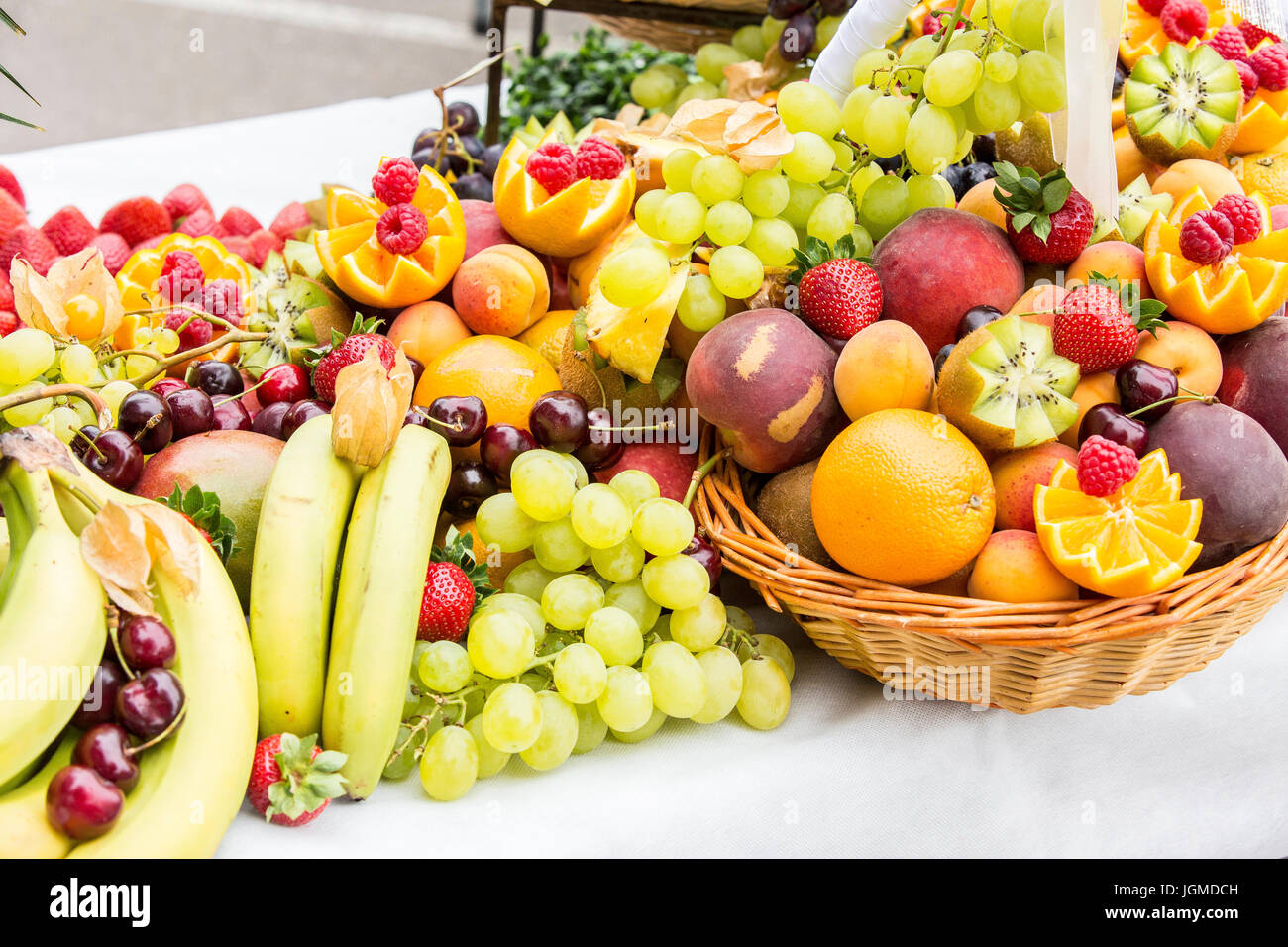 Composition of assortment of fresh fruits in baskets Stock Photo - Alamy