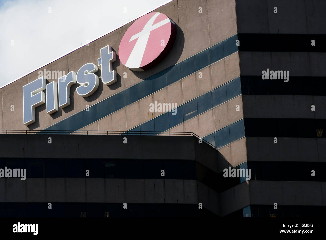 A logo sign outside of the headquarters of FirstGroup America, Inc., in ...