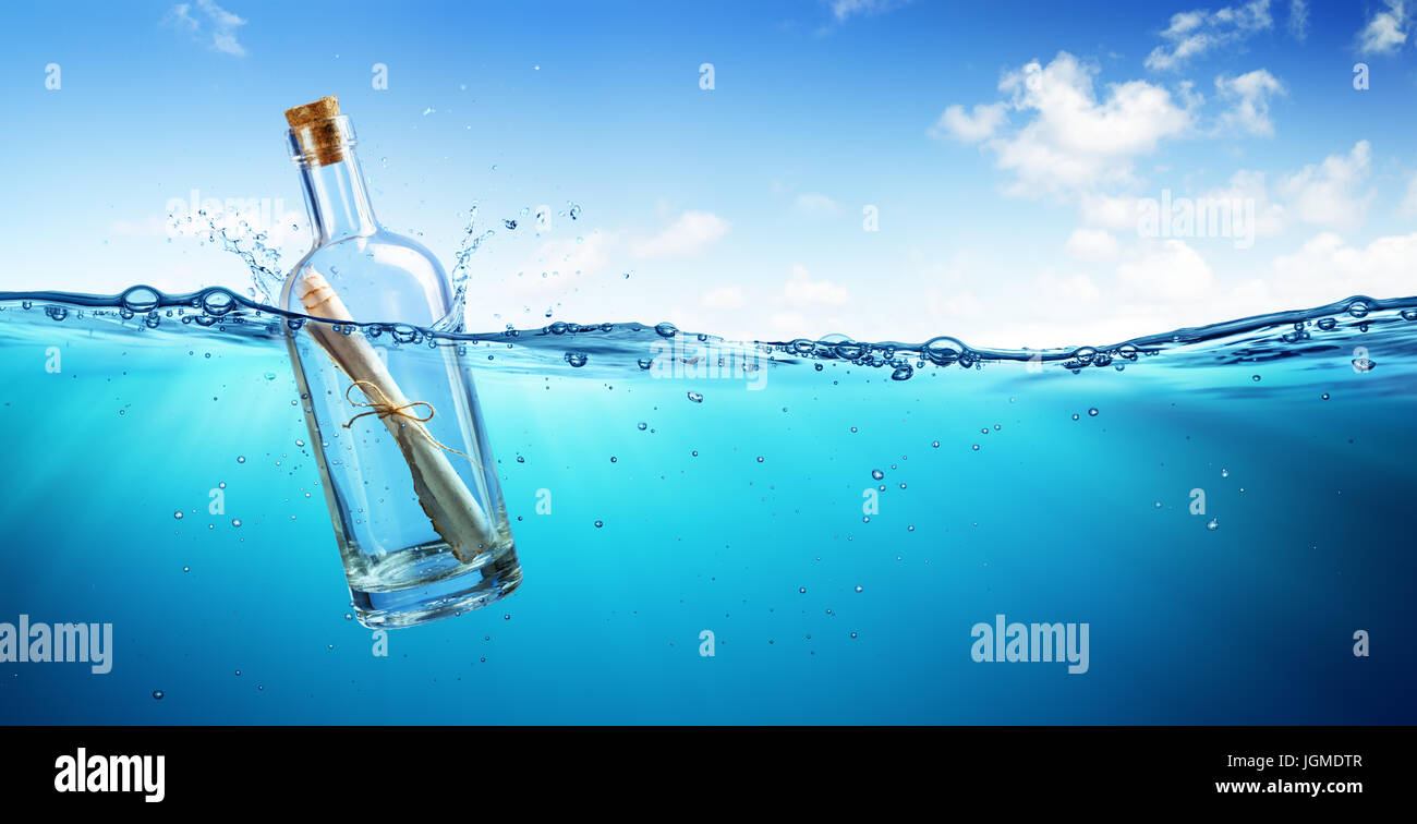 Message In Bottle floating In The Ocean Stock Photo - Alamy
