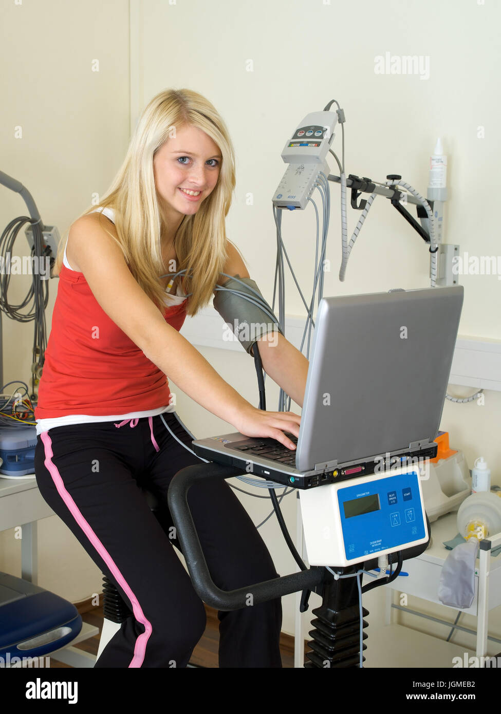 Young woman carries out an ergometer test in the medical practise ...