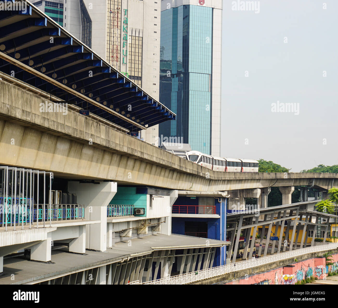 Kuala Lumpur, Malaysia - Jun 6, 2015. A LRT train running on the track ...