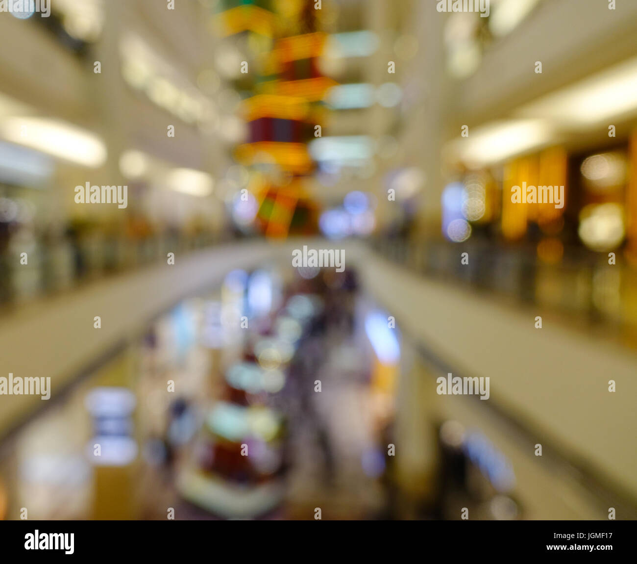 Defocused shopping mall interior with many shops at night Stock Photo ...