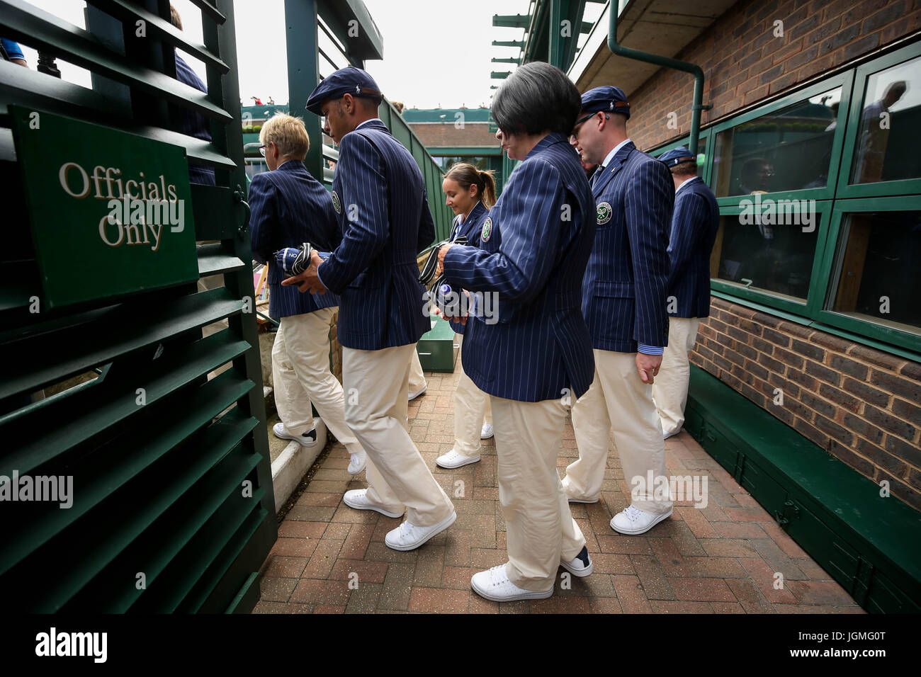 Wimbledon officials arrive on court eighteen on day six of the ...