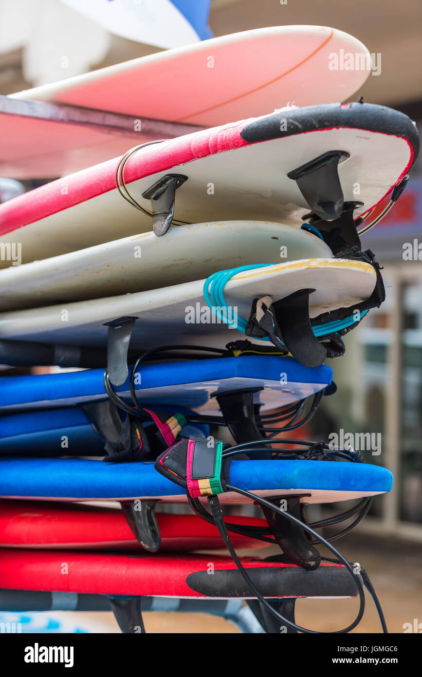 set of different color surf boards in a stack. France Stock Photo - Alamy