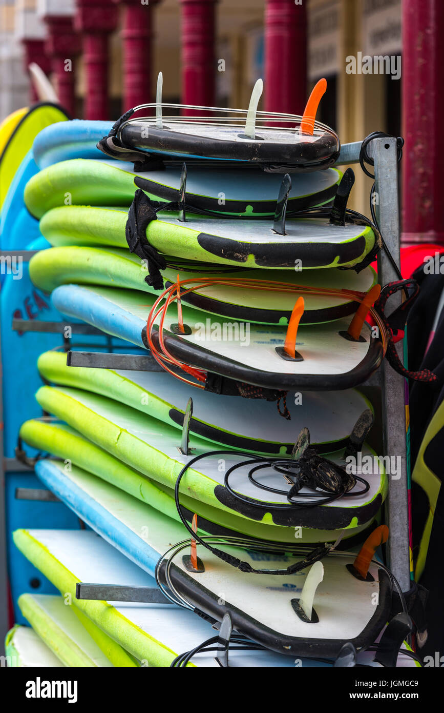 Set of different color surf boards in a stack. France Stock Photo - Alamy