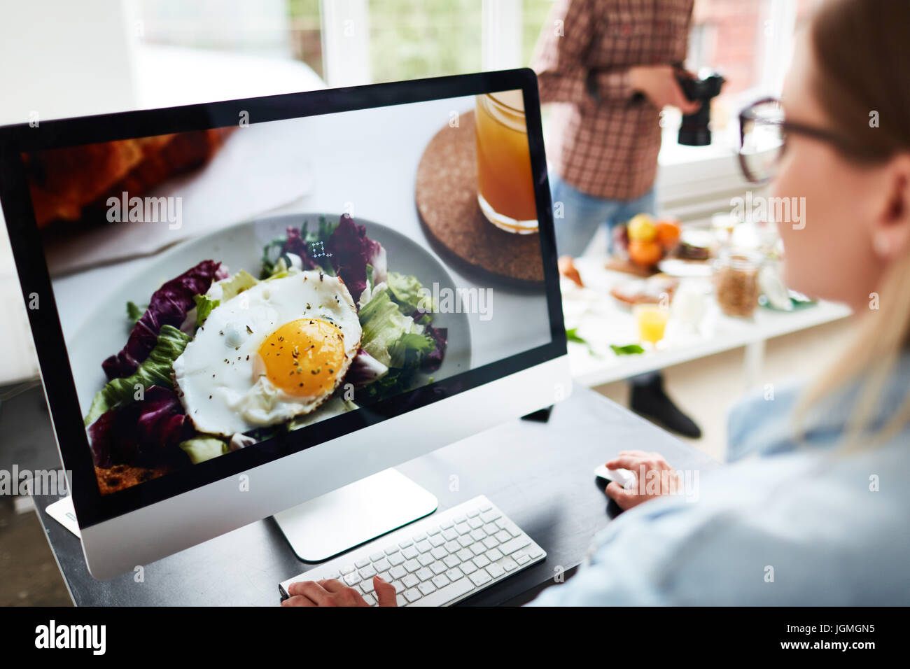 Food-designer editing images for food-advert Stock Photo - Alamy