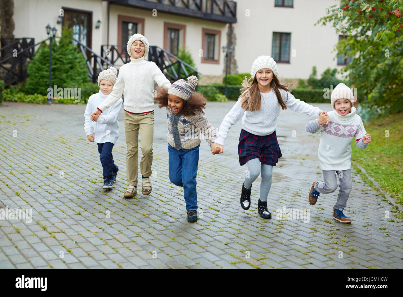 Group children running towards camera hi-res stock photography and ...
