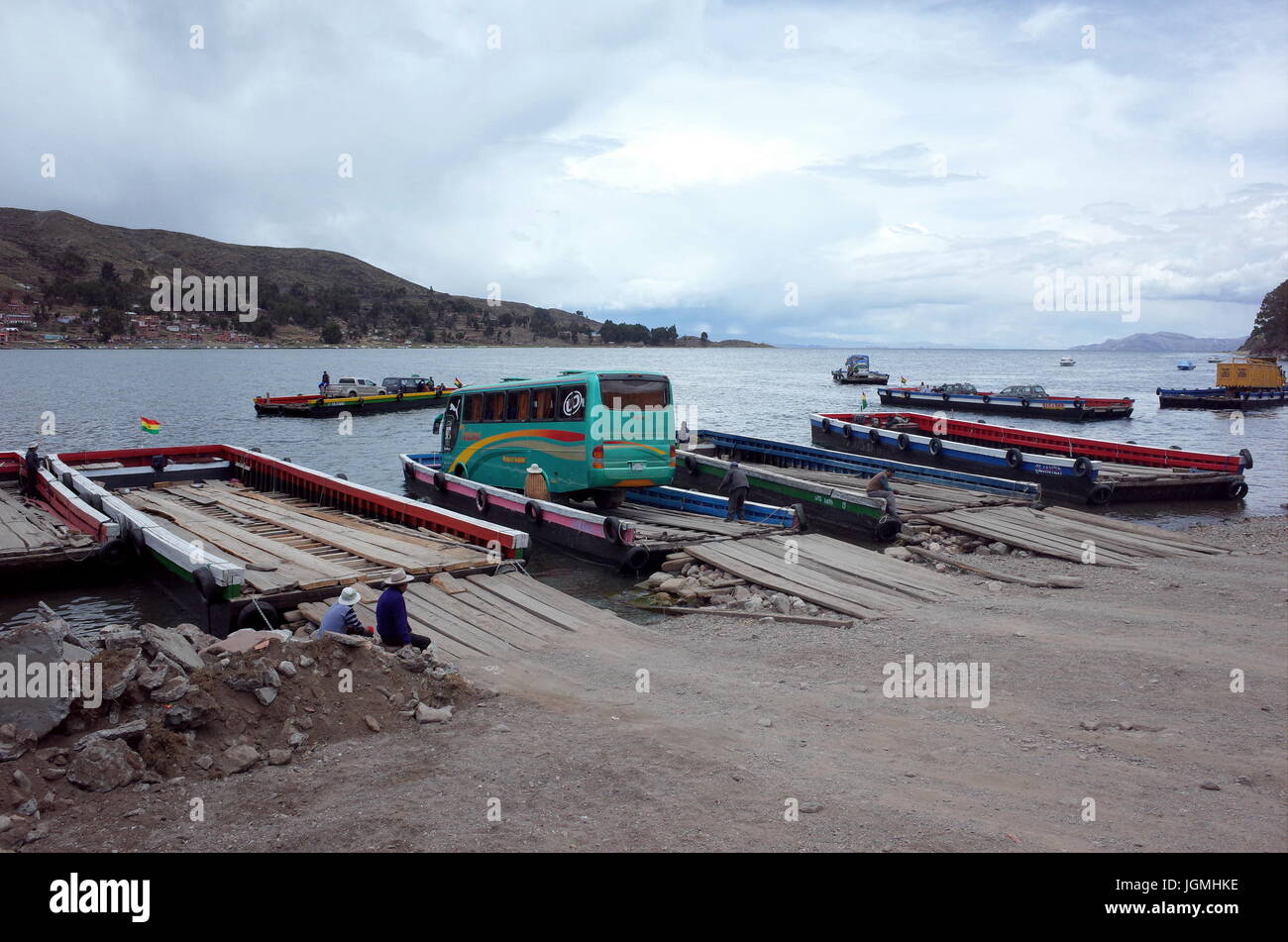 A ferry taking a bus across Lake Titicaca between the Isla del Sol and ...