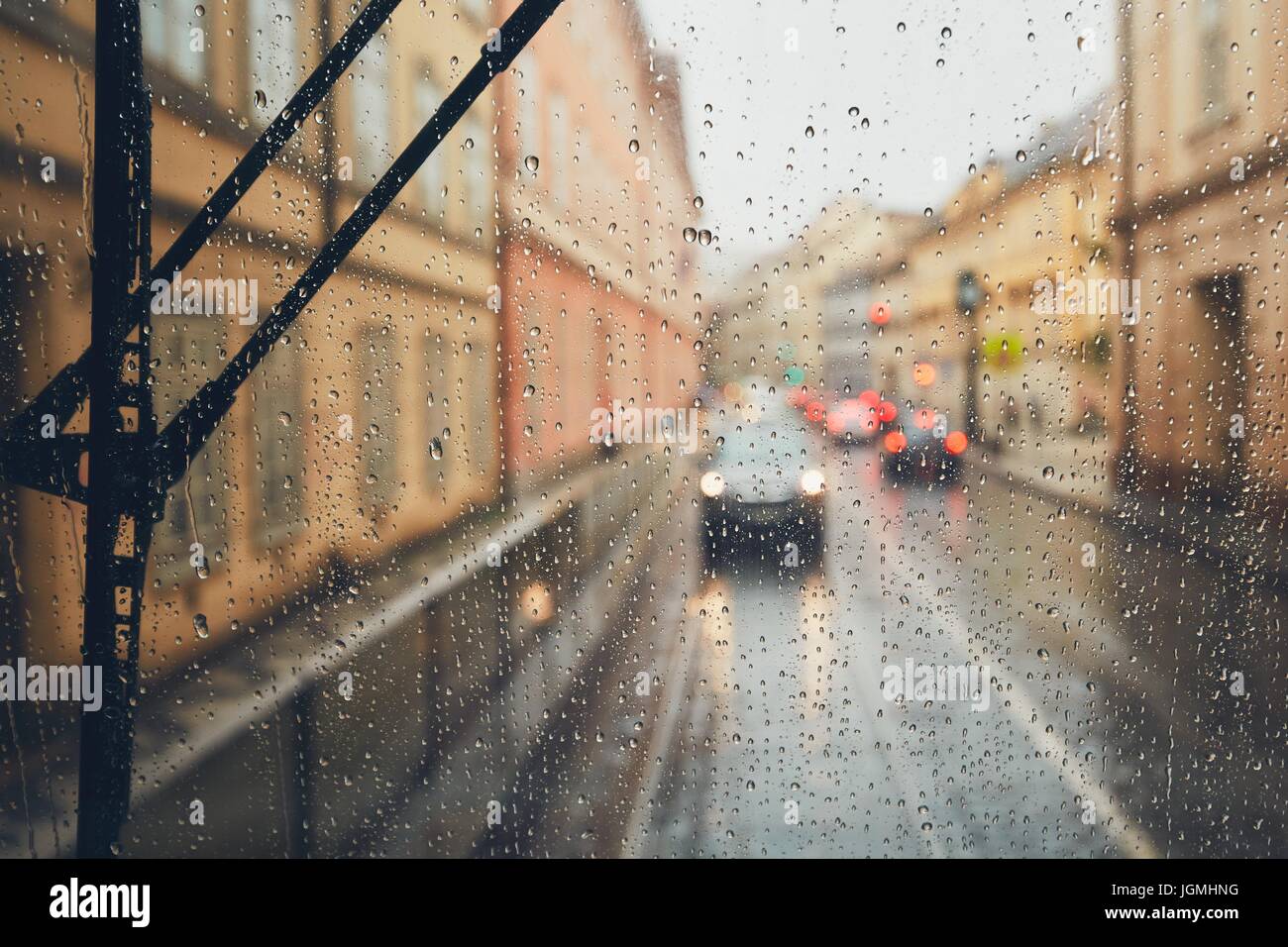 Gloomy day in the city. Street in rain. Selective focus on the ...