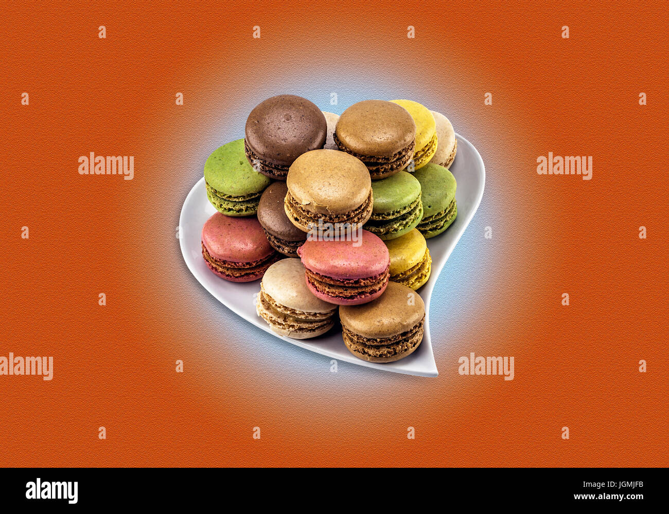 Plate of Macarons on a brown background Stock Photo - Alamy